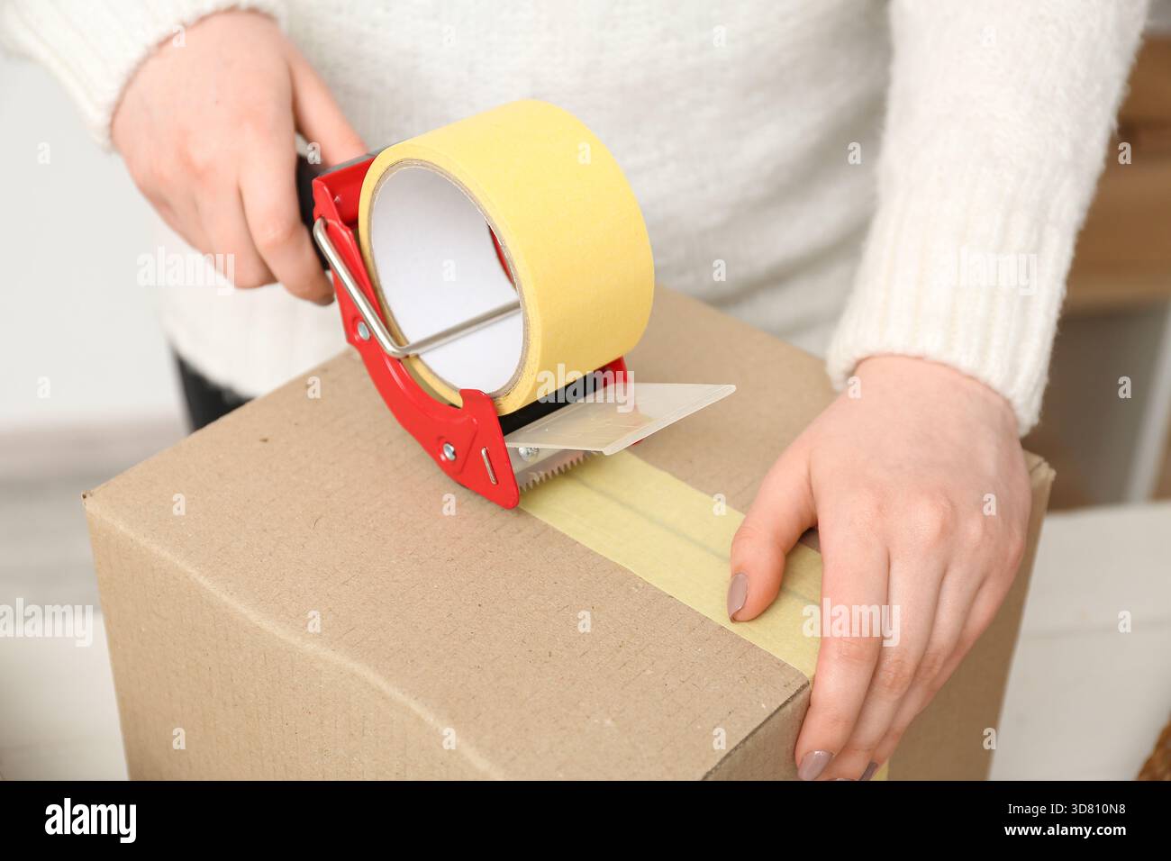 Taping box tape dispenser hi-res stock photography and images - Alamy