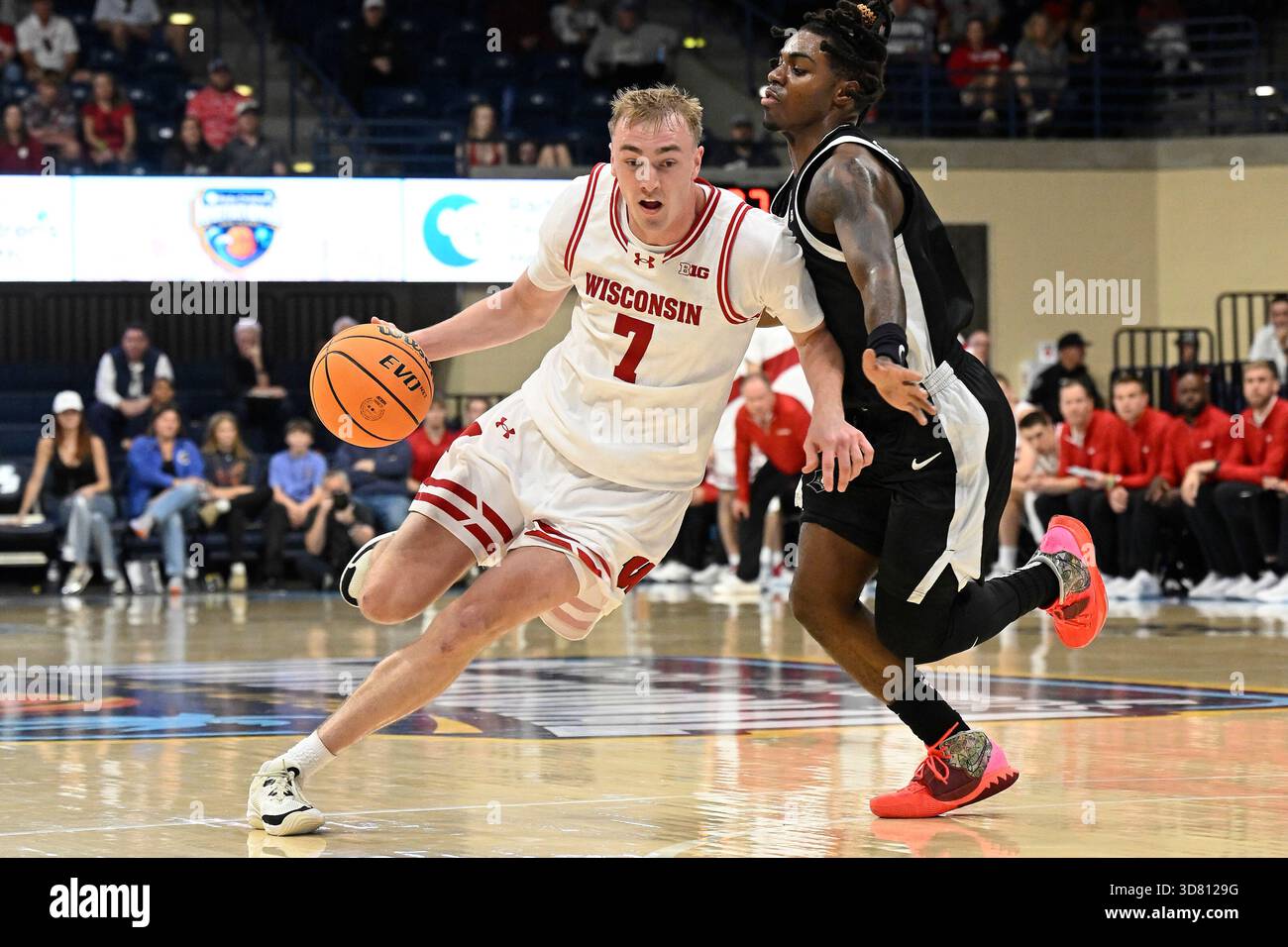 Wisconsin guard Andrew Rohde (7) drives past Providence guard Jason ...