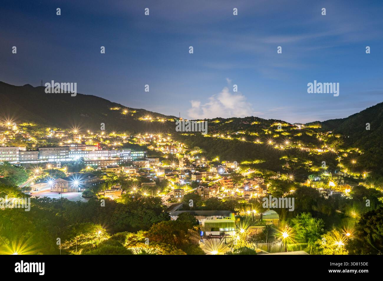 Jinguashi,Taiwan Lights shimmer across the hillside town, tracing ...