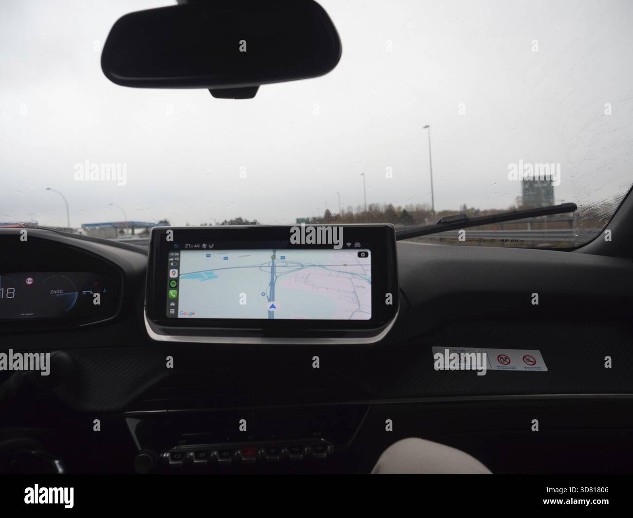 Car dashboard view showing a navigation system on a highway, editorial ...