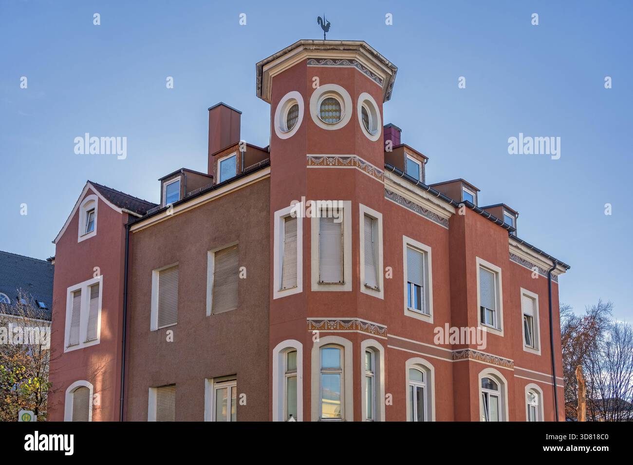 Reddish facade with chimneys, turret and weather vane, Kempten, Allgaeu ...
