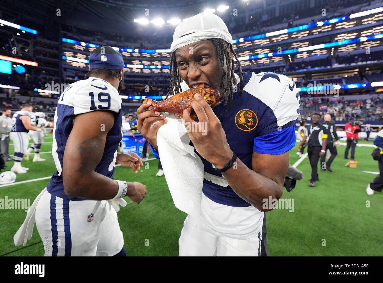 Dallas Cowboys wide receiver George Pickens (3) takes a bite from a ...