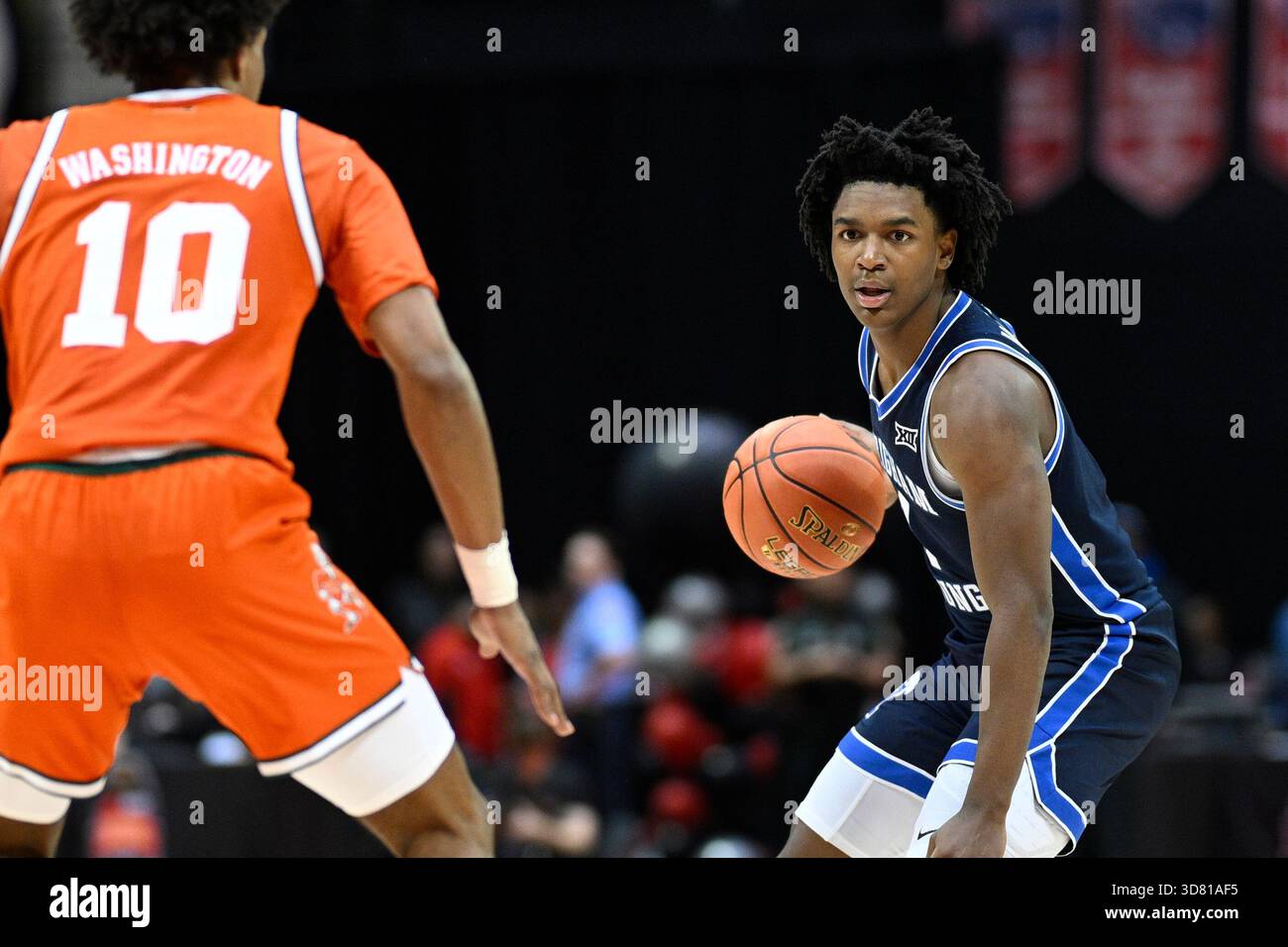 BYU guard Robert Wright III, right, is defended by Miami guard Tru ...