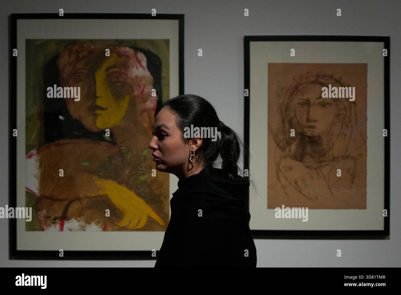 A woman visits an exhibition of work by Iranian artist Bahram Dabiri at ...