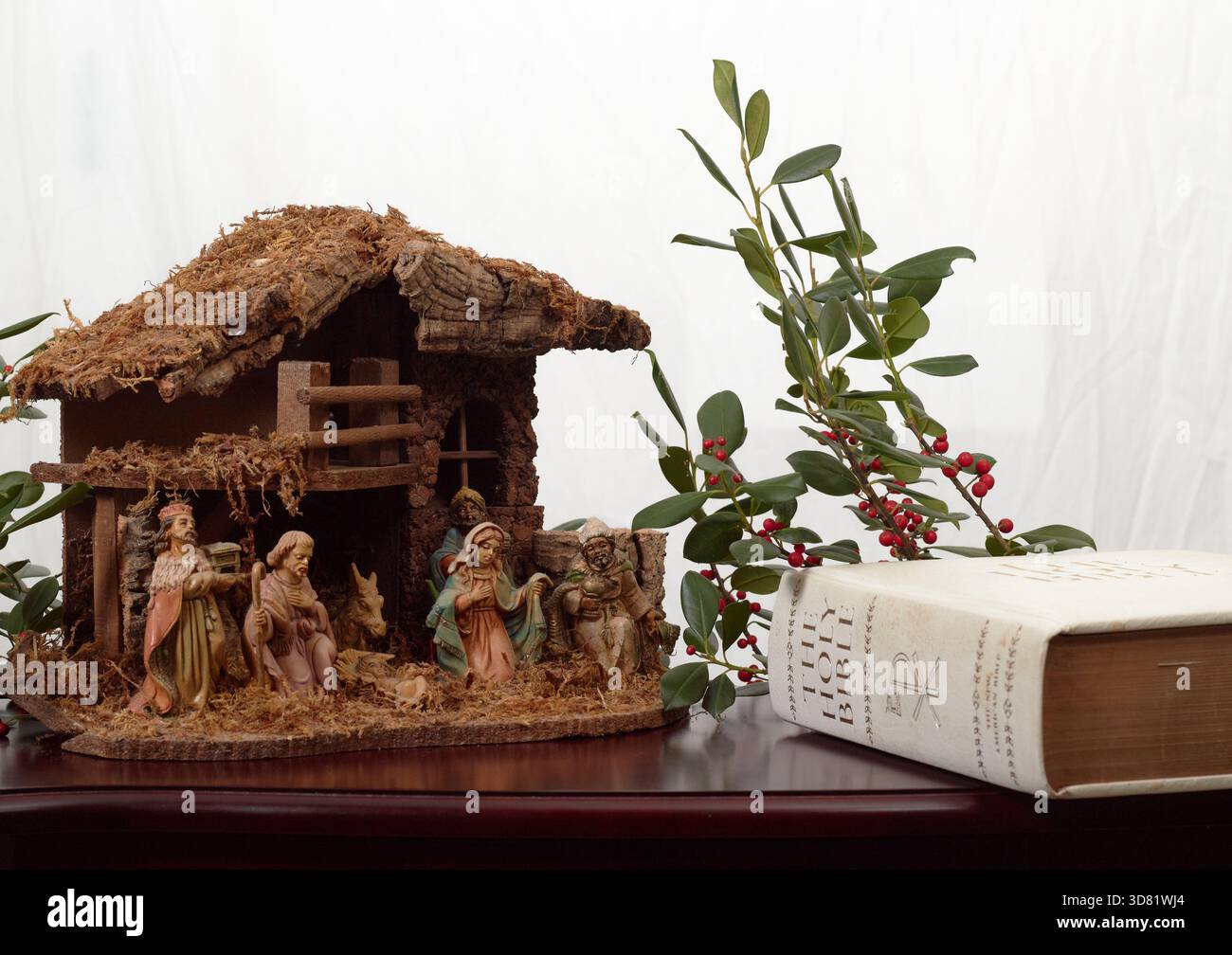Vintage manger with a vintage white catholic bible hi-res stock ...