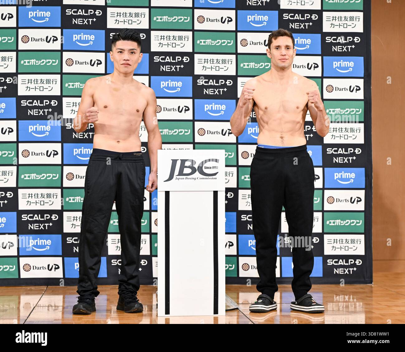 Japan's Tomoya Tsuboi, left, and Mexico's Carlos Cuadras pose during ...