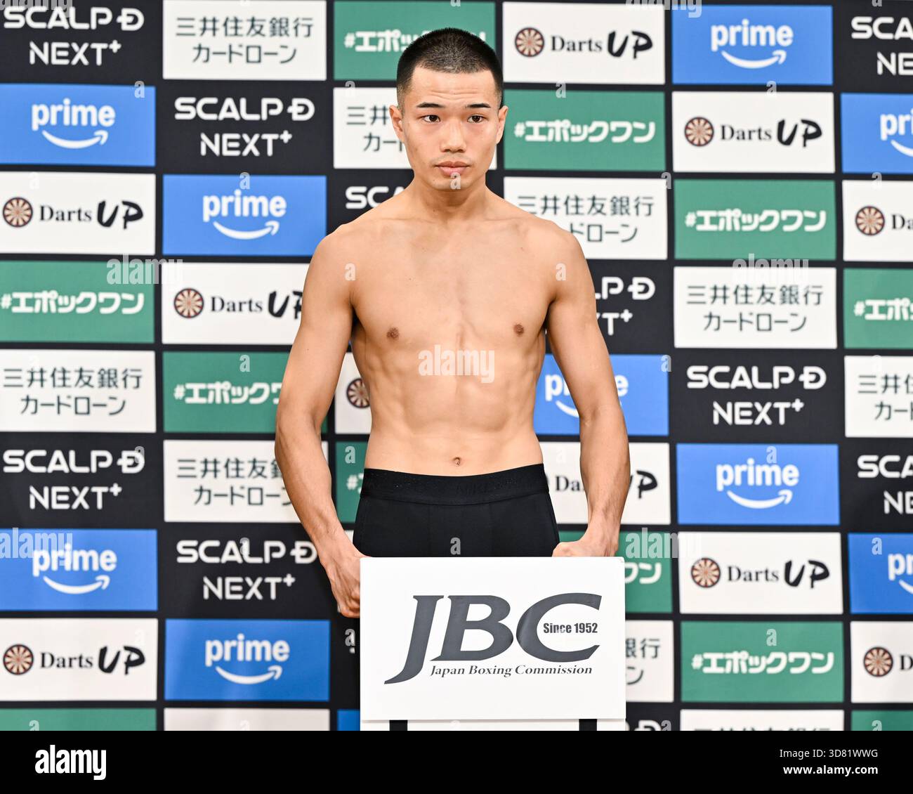 Japan's Riku Masuda poses on the scale during the official weigh-in for ...