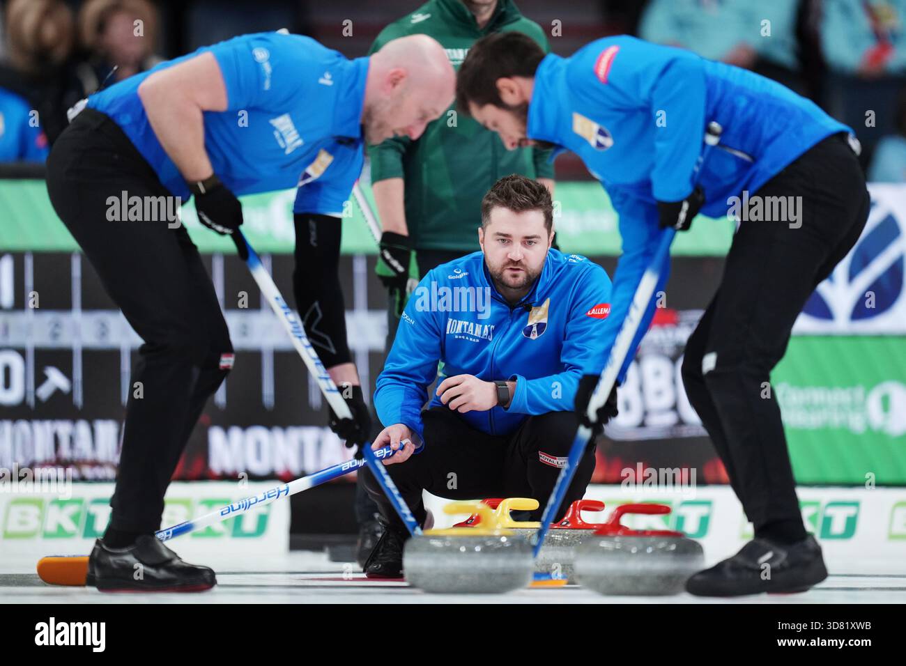 Skip Matt Dunstone, centre, directs his sweepers during the men's ...