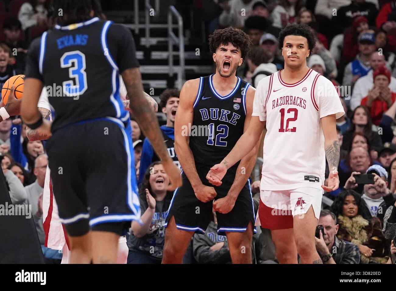 Duke forward Cameron Boozer (12) celebrates after scoring as Arkansas ...