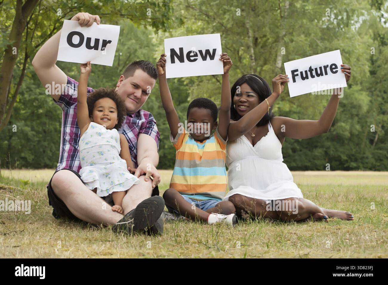African multicultural family is holding white boards Stock Photo - Alamy