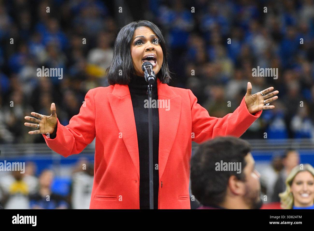 DETROIT, MICHIGAN - NOVEMBER 27: CeCe Winans performs the National Anthem before a NFL game ...