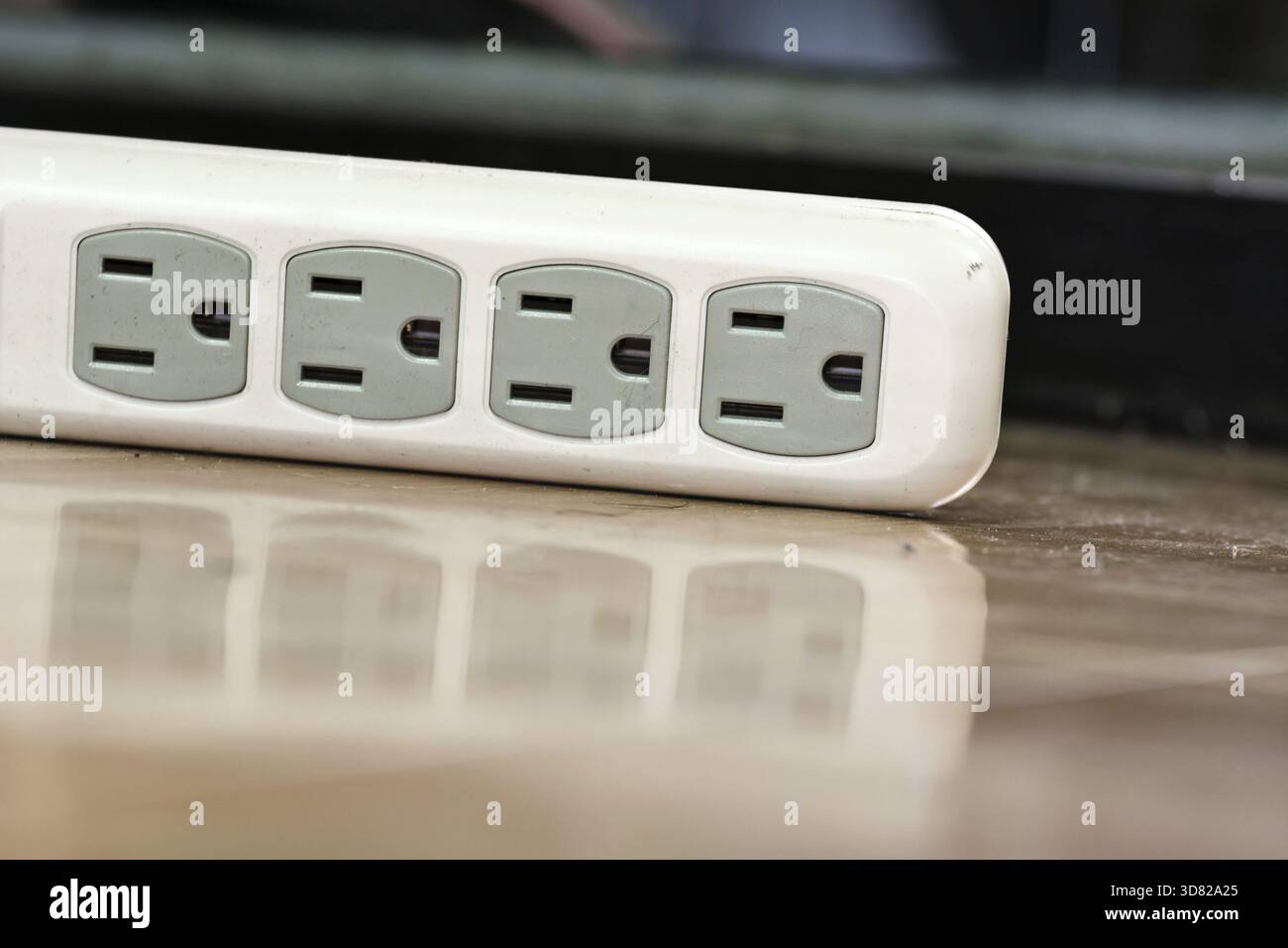 White power strip or extension block laying on the floor Stock Photo ...