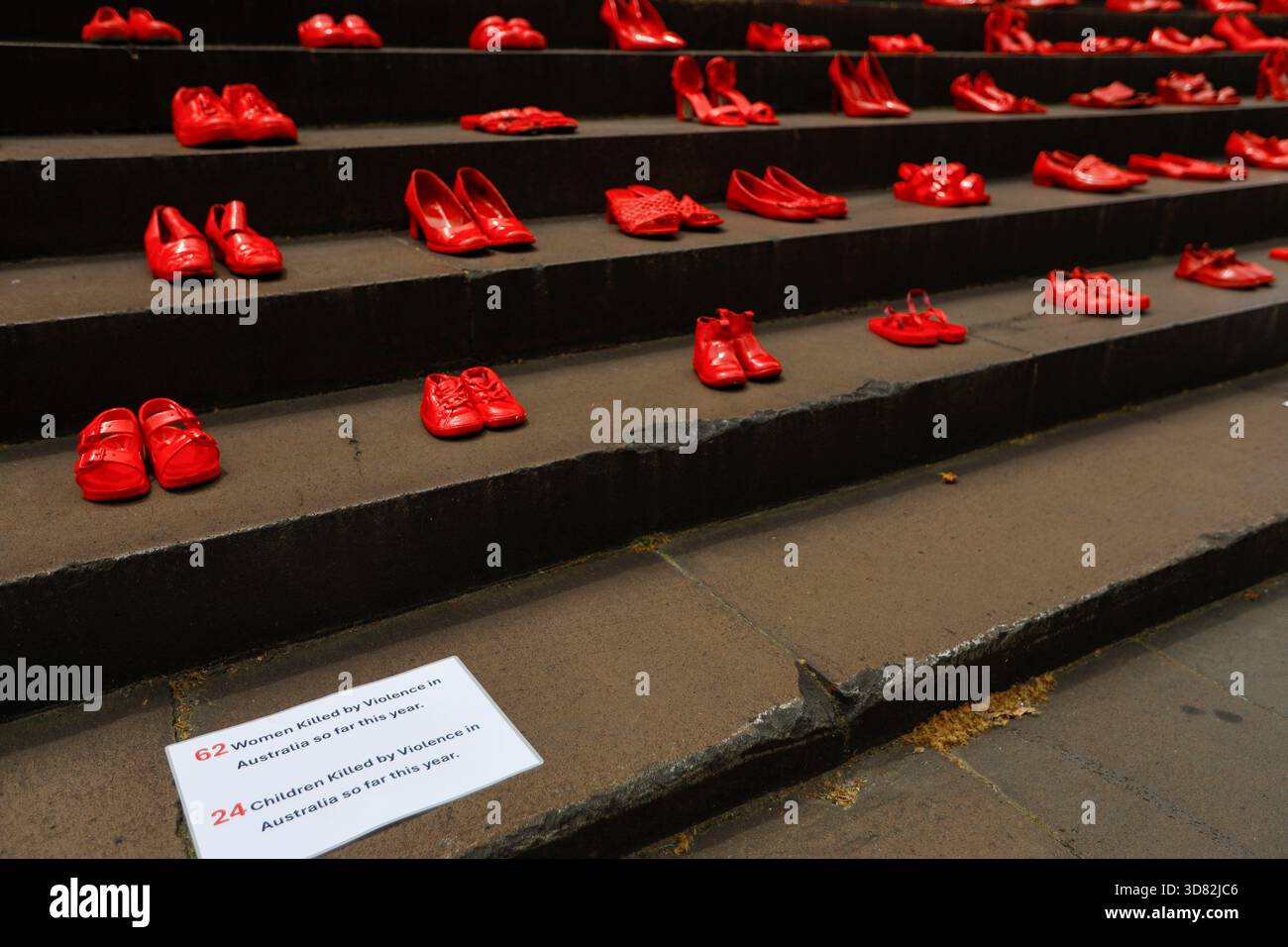 Red shoes are placed on the steps of Treasury Place in memory of the 62 ...