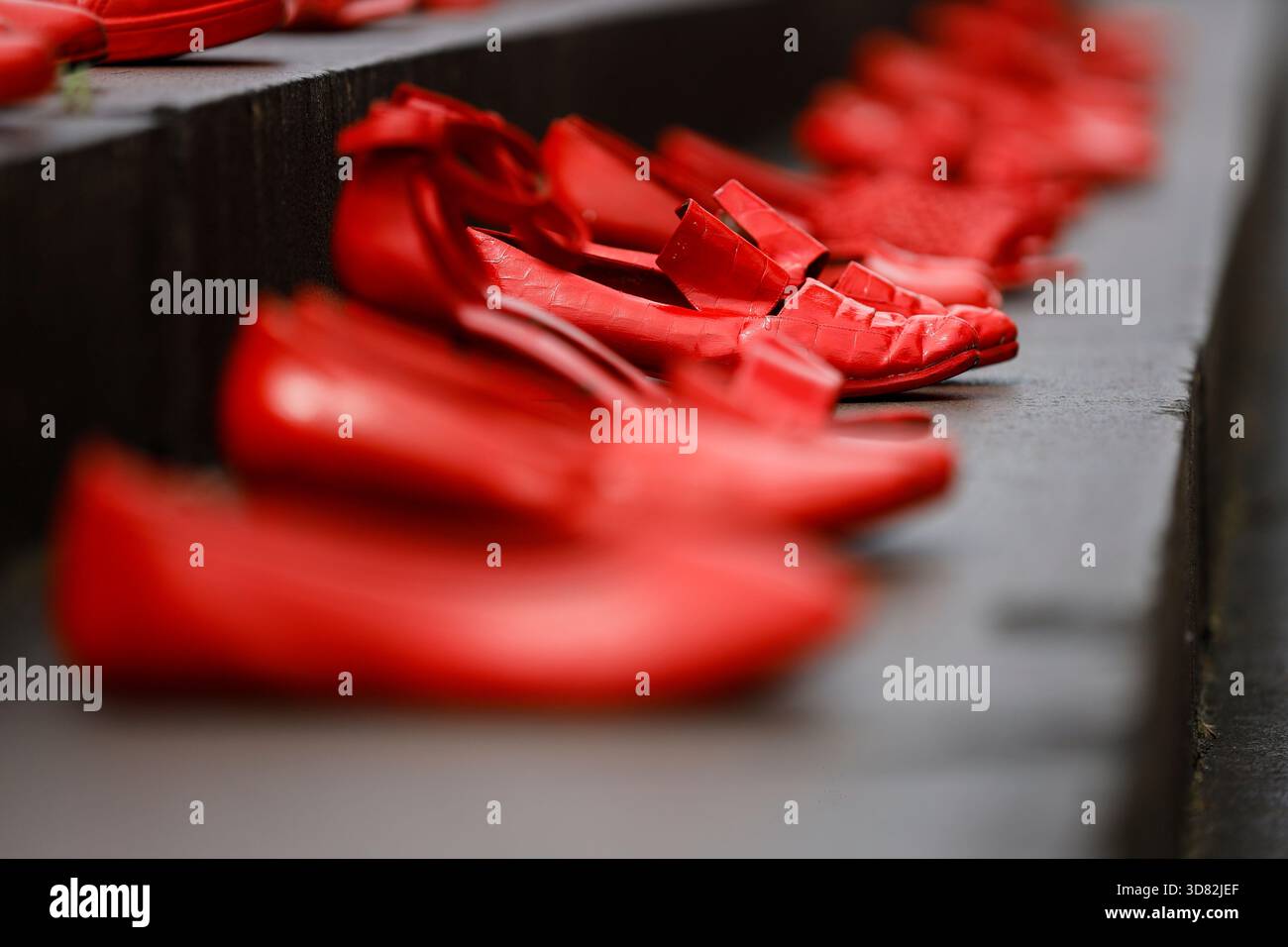 Red shoes are placed on the steps of Treasury Place in memory of the 62 ...