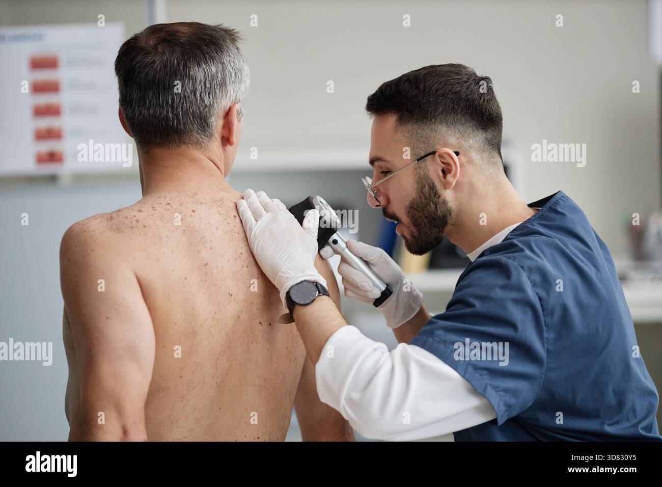 Middle Aged Caucasian Man Undergoing Skin Examination by Male ...
