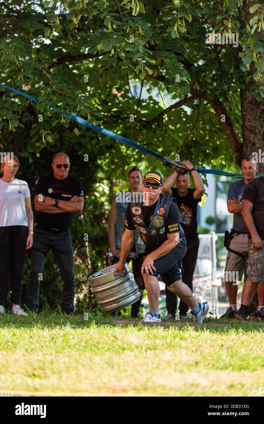 Draft keg throwing contest at moto camp in Prnjavor during moto meet ...