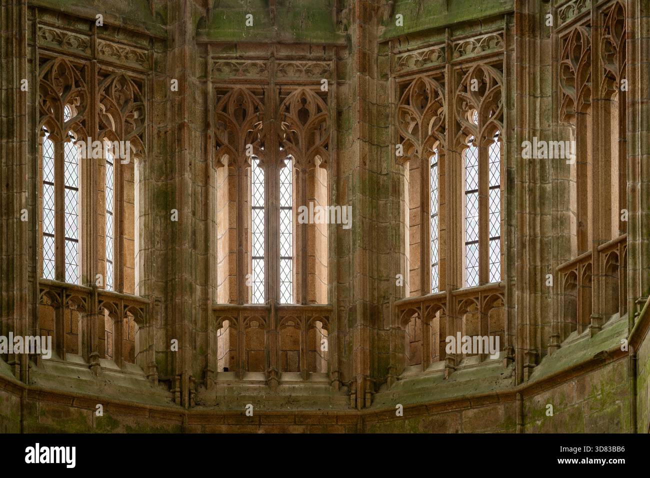 Gothic stained-glass windows and intricate stone tracery inside Mont ...