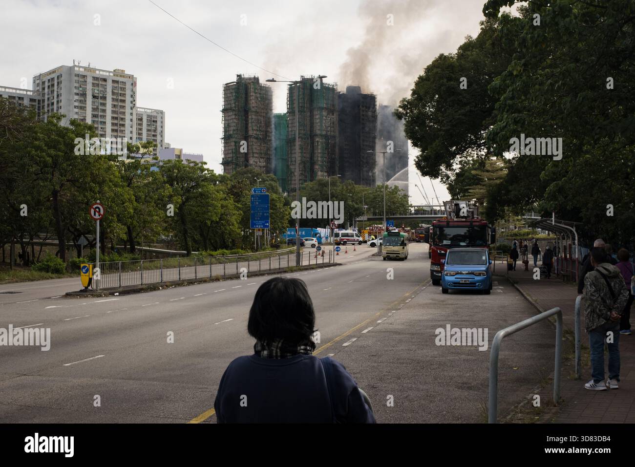 The local residents are seen spectating the burning towers in Wang Fuk ...