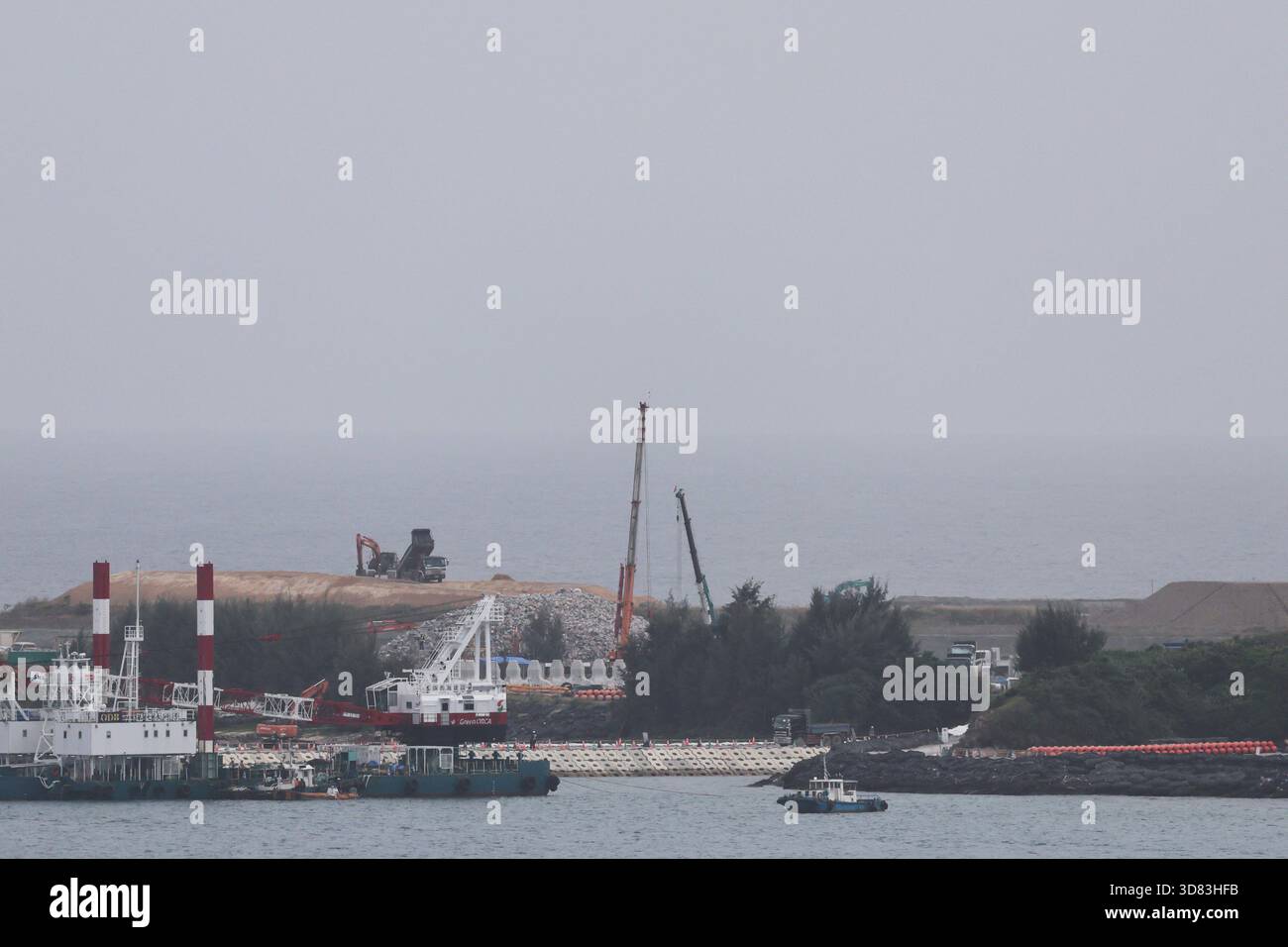 A photo shows Oura Bay, where soil transport for landfill work is ...
