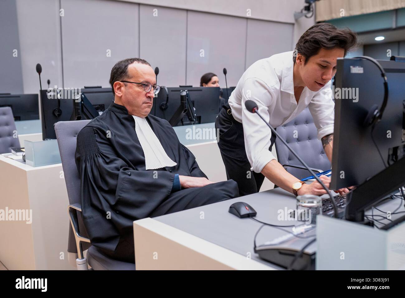 Defense attorney Nicholas Kaufman, left, waits for the International ...