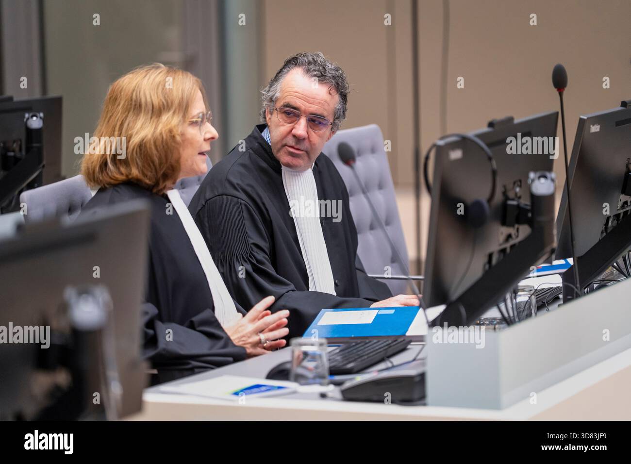 Prosecutors Helen Brady, left, and Julian Nicholls wait for judges to rule on a request to ...