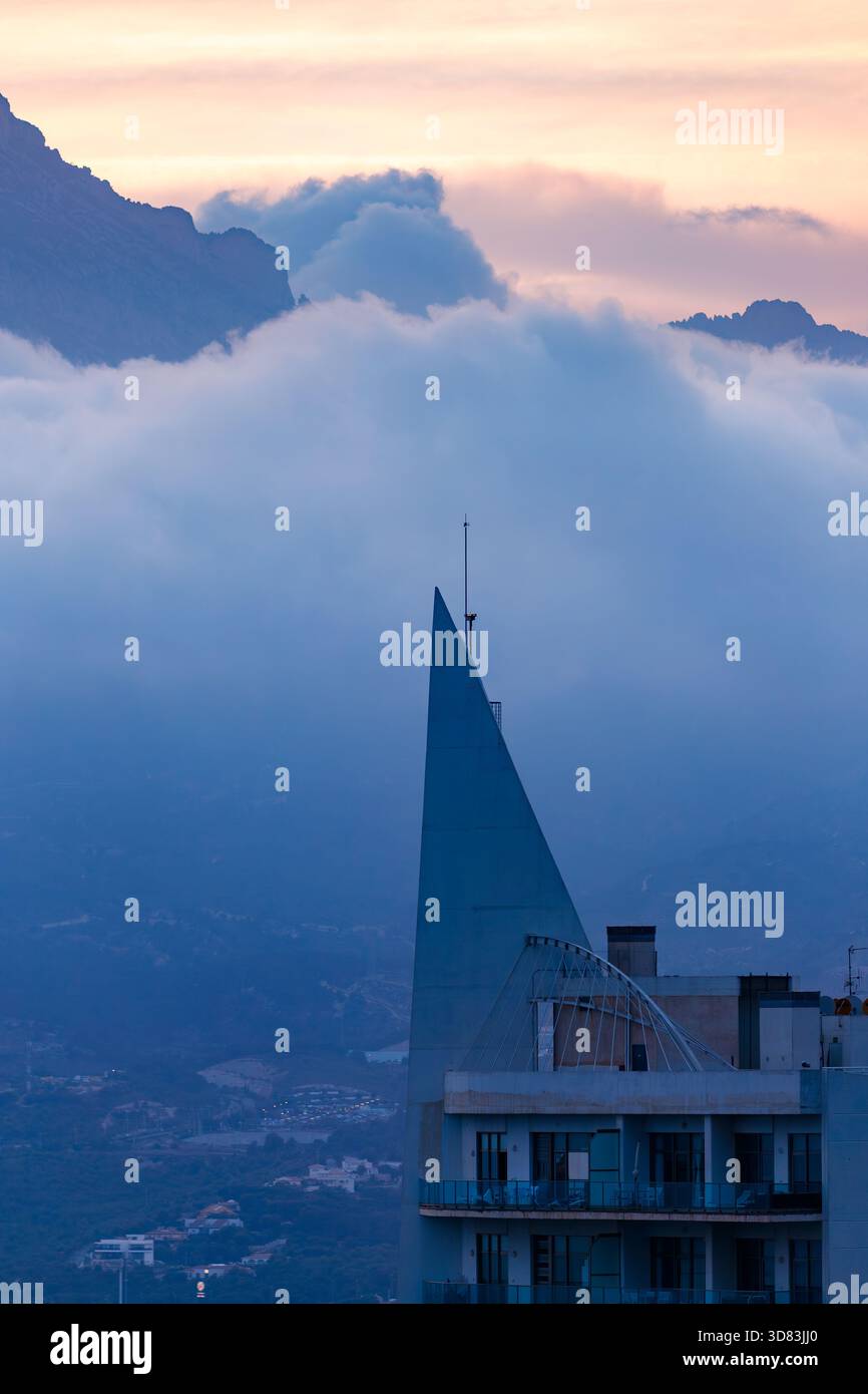Sail-Shaped Skyscraper Above the Clouds Stock Photo - Alamy