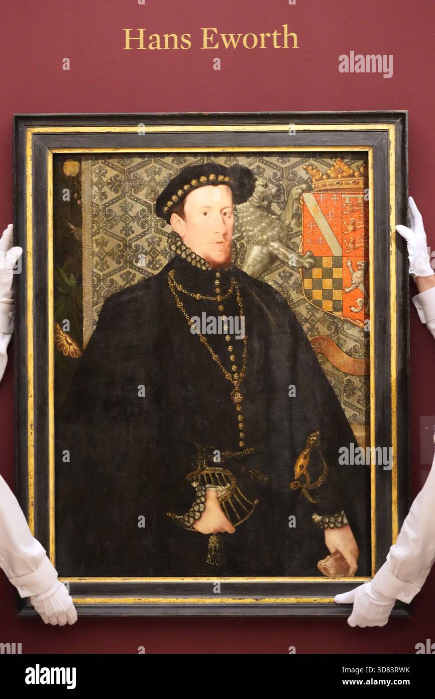 Sotheby's staff adjusts the Hans Eworth Portrait of Thomas Howard ...