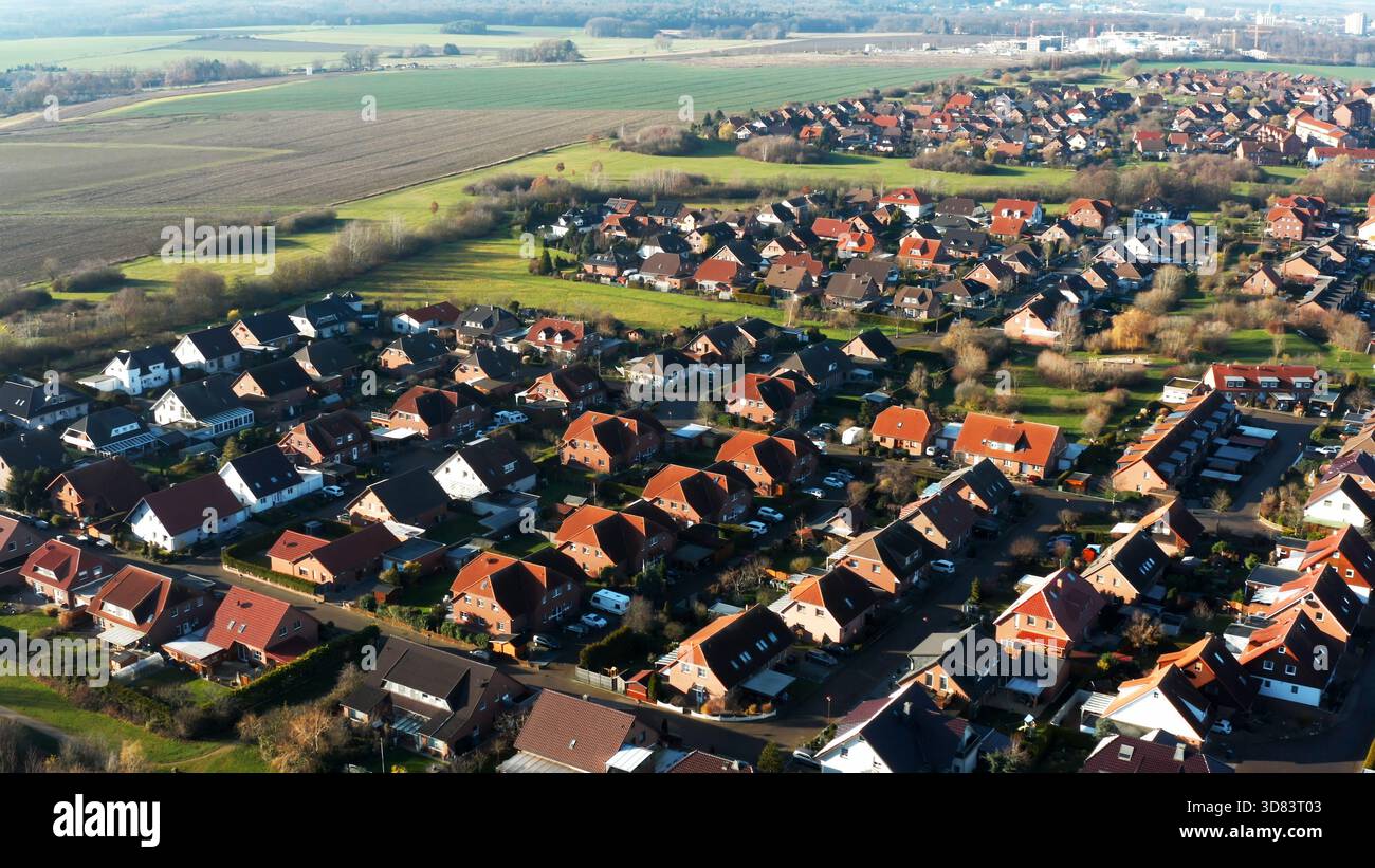Aerial view showing a residential suburb with many houses, green spaces ...