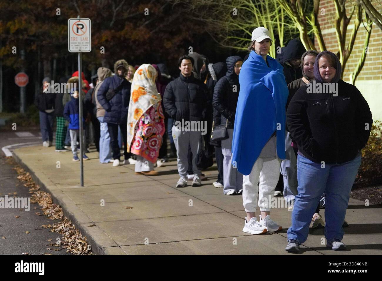 Shoppers stand in line to enter Kohl's department store for Black ...