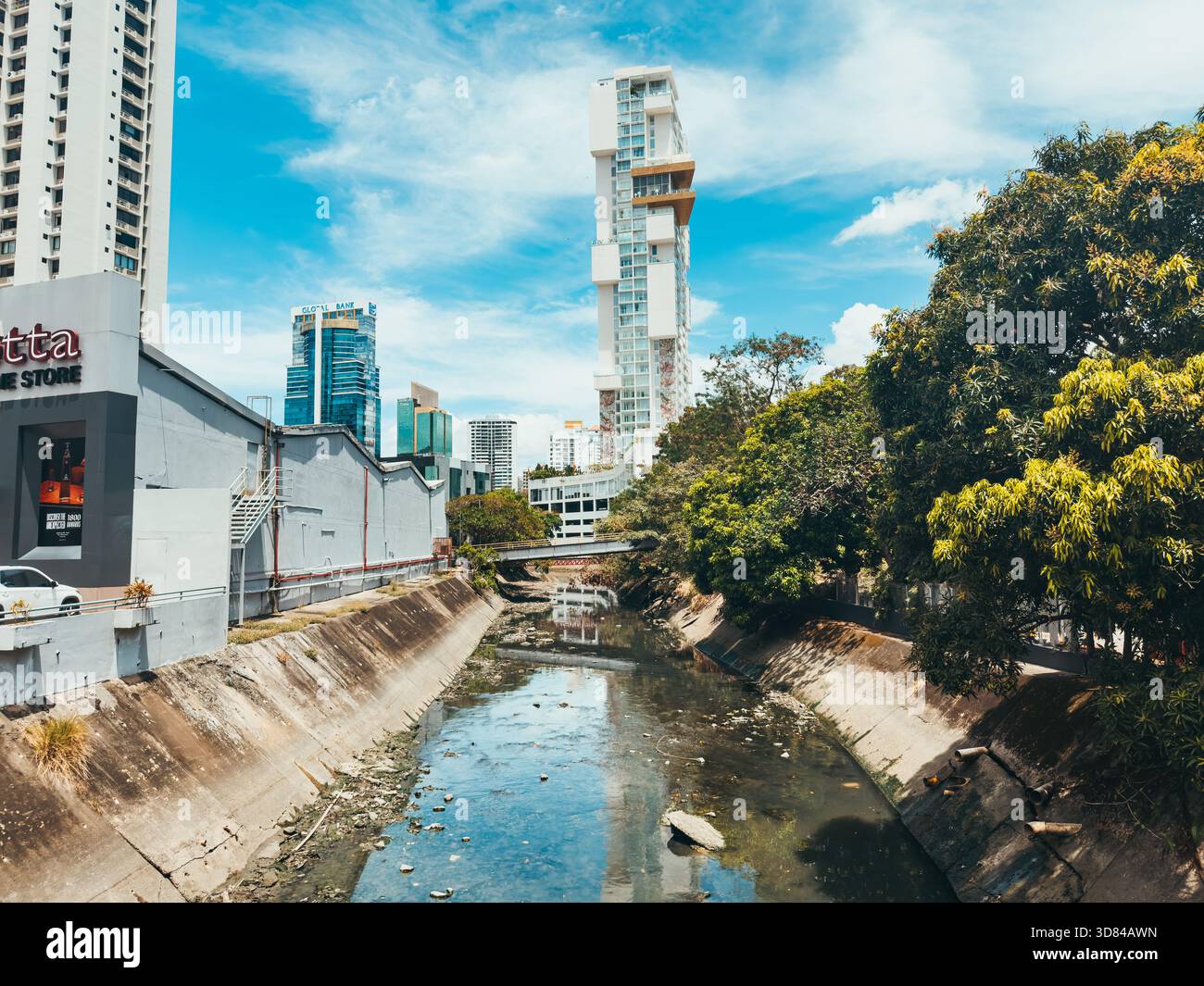 Urban canal in Panama City with modern high-rises, including the iconic ...