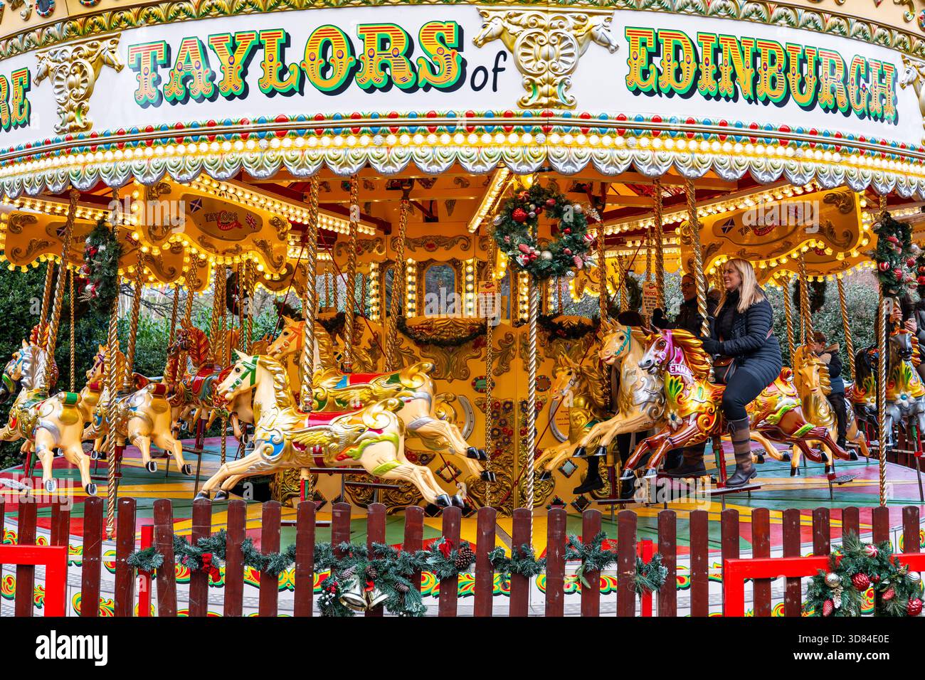 Women on Venetian carousel, Edinburgh Christmas market, Princes Street ...