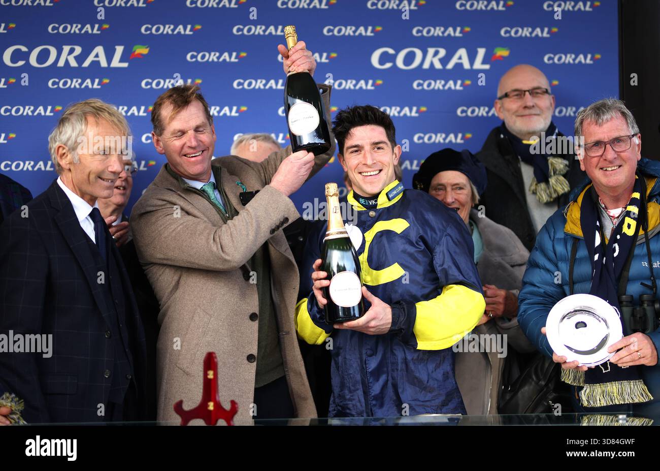 Jockey Gavin Sheehan (centre) and trainer Jamie Snowden (second left ...