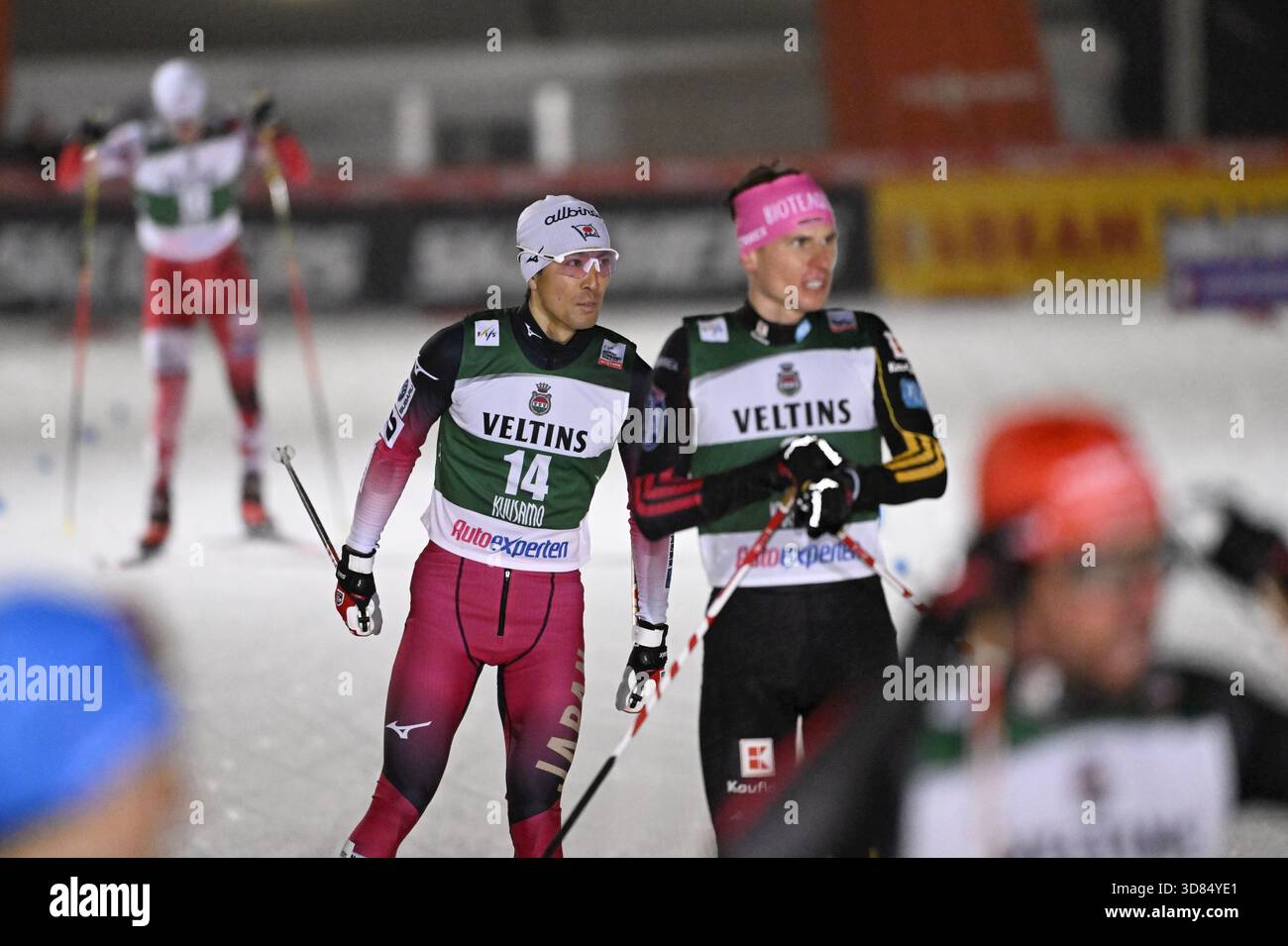 Akito Watabe of Japan (L) competes during 7,5 km Cross-Country Skiing ...