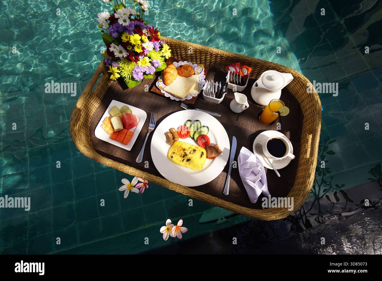 Set of floating breakfast tray in swimming pool. Breakfast in swimming ...