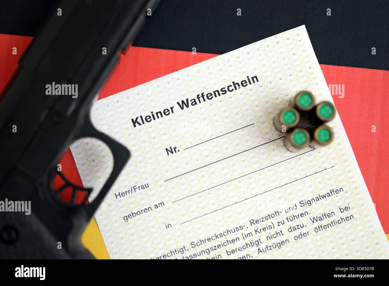 German light firearms license and handgun with bullets on Germany flag ...