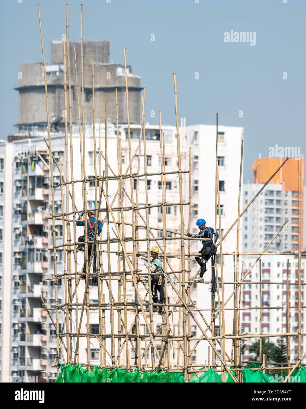 March 24, 2025, Hong Kong, China: Bamboo scaffolding workers, known as ...