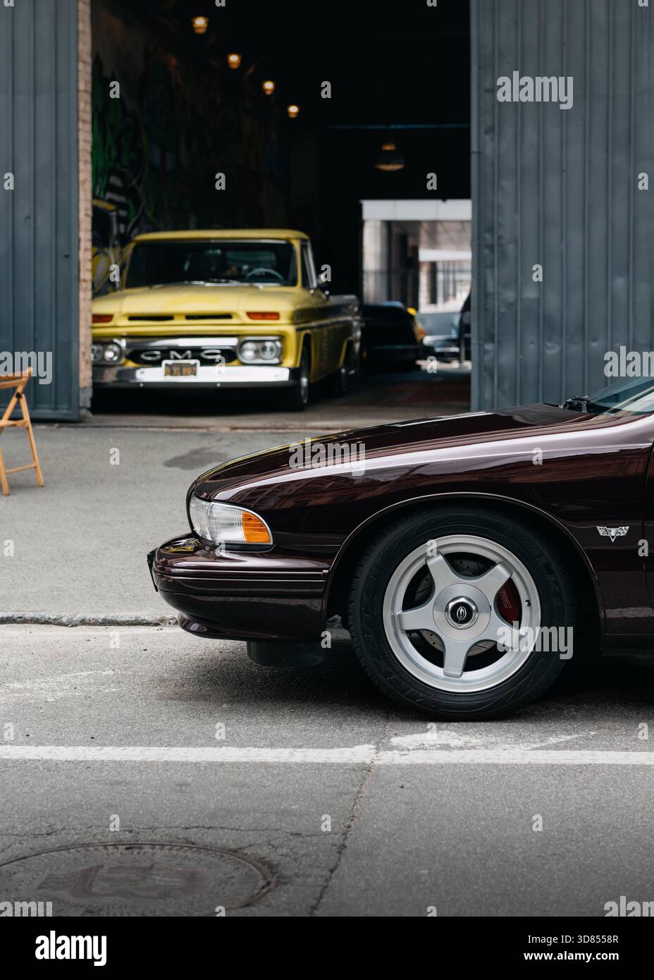 Classic american cars on the street. Front side part of dark burgundy ...
