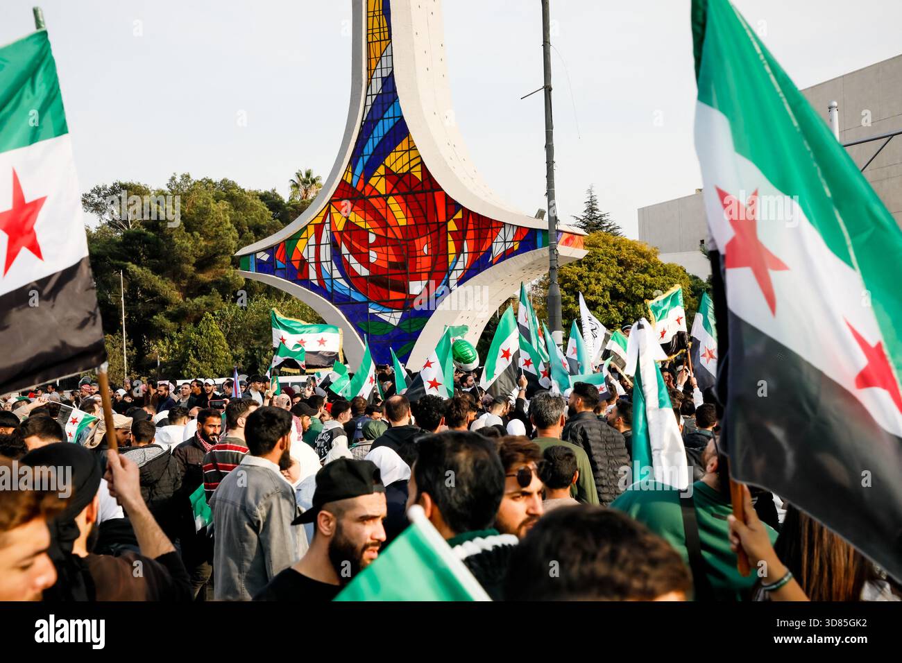 Thousands of Syrians gather in Umayyad Square in central Damascus to ...