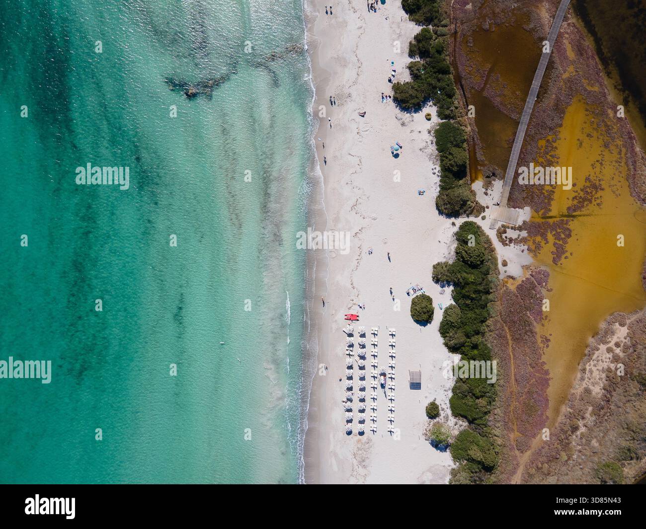 Aerial view of a pristine beach where turquoise waters meet the soft ...