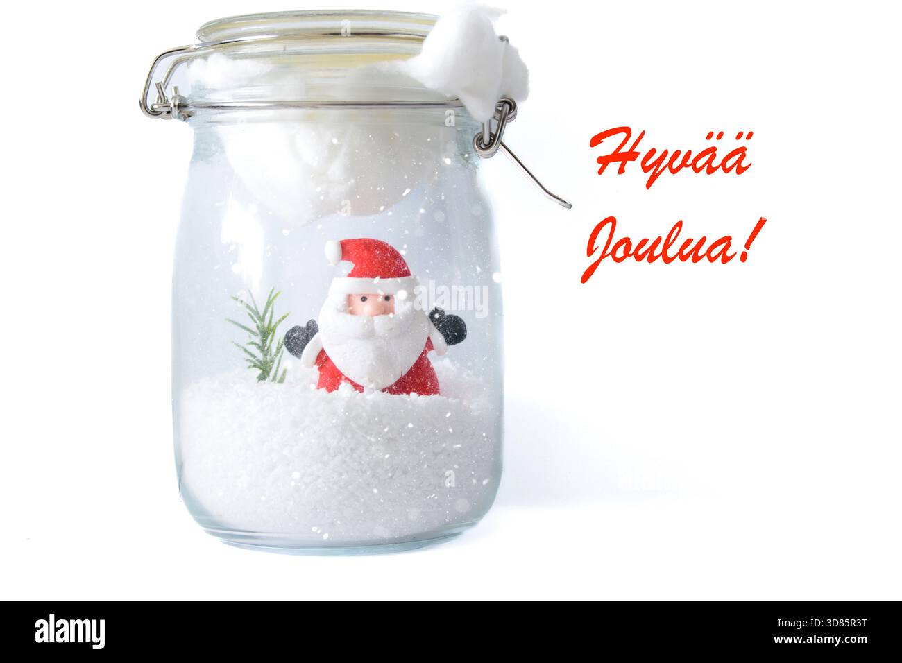 Santa in snowy glass jar with Finnish Hyvaa Joulua greeting on white ...