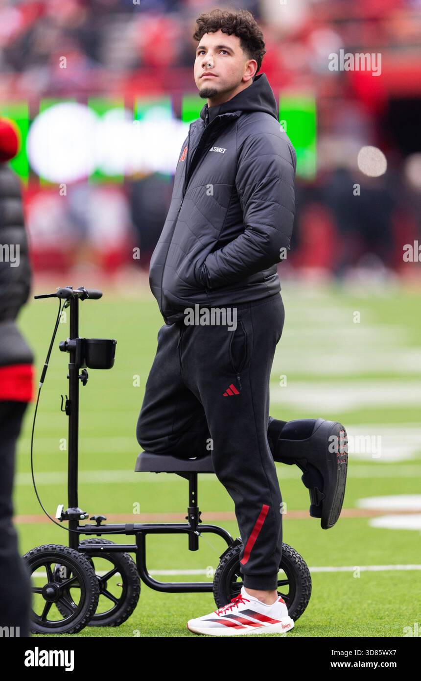 Nebraska quarterback Dylan Raiola watches his team warm up as he ...