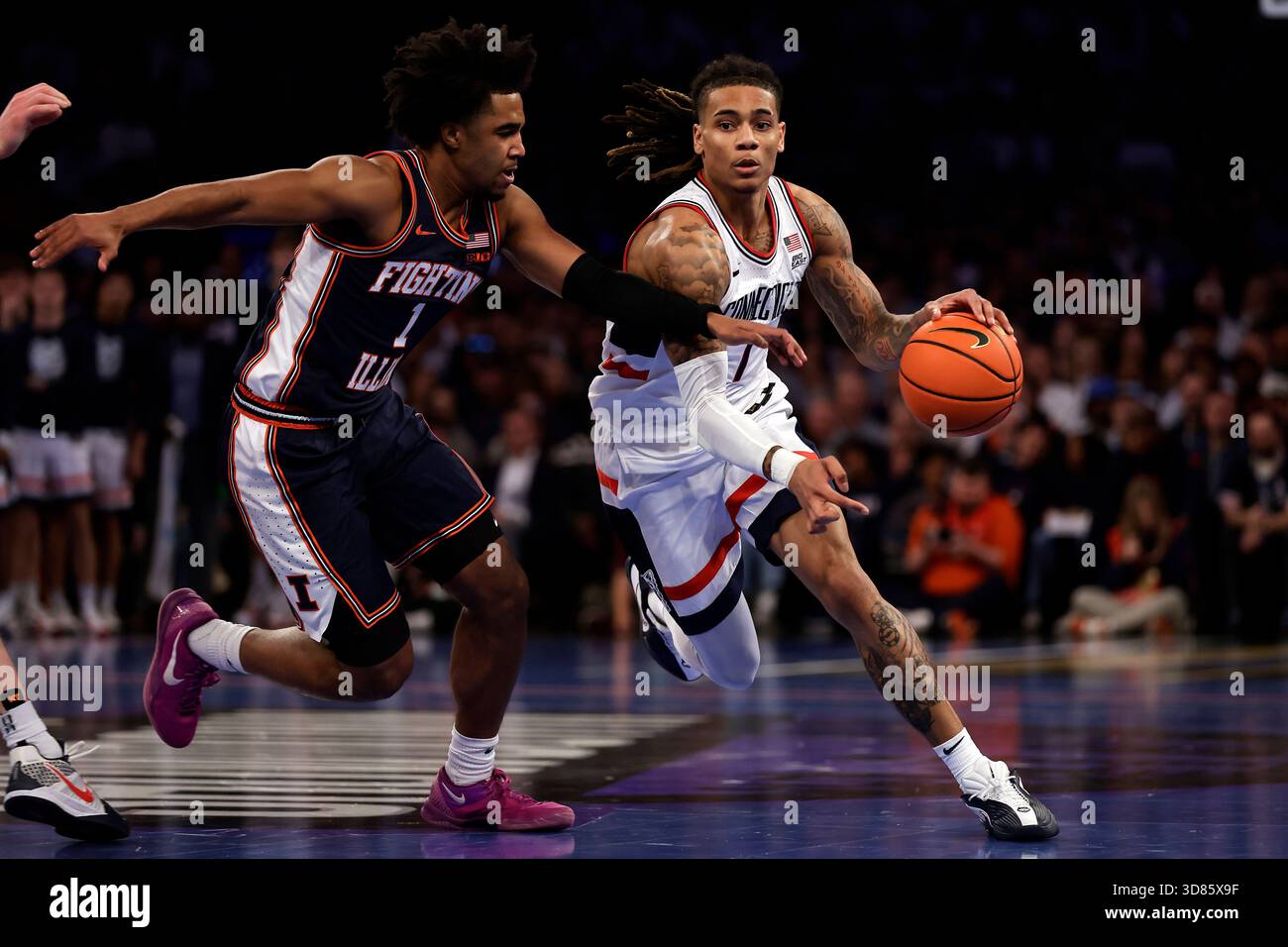 UConn guard Solo Ball, right, drives past Illinois guard Brandon Lee ...