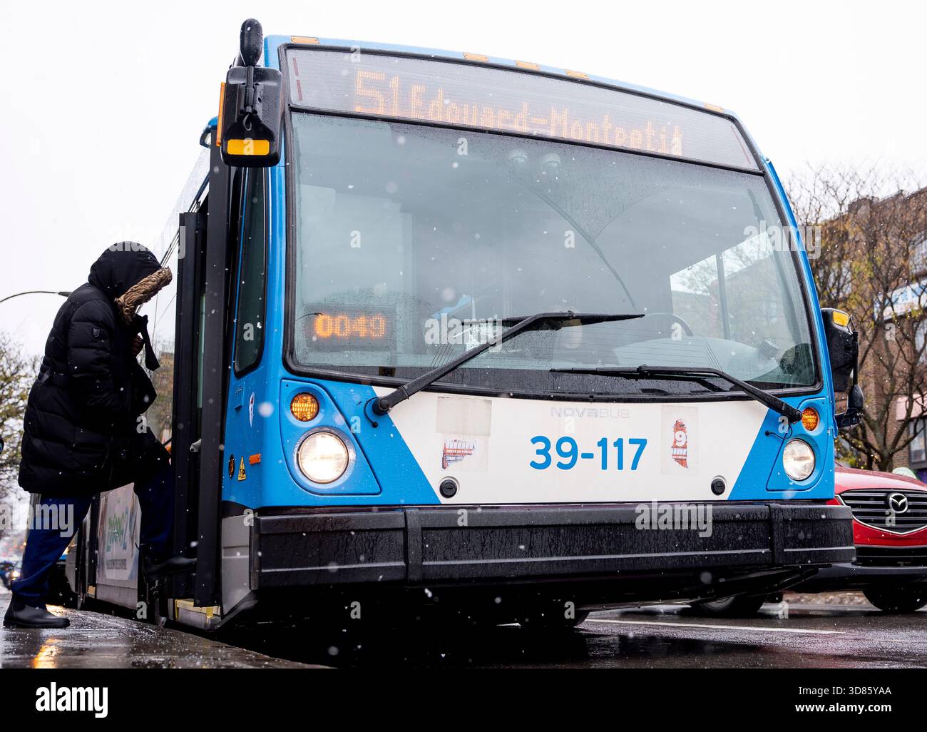 People board a Montreal transit agency bus in Montreal on Friday, Nov ...