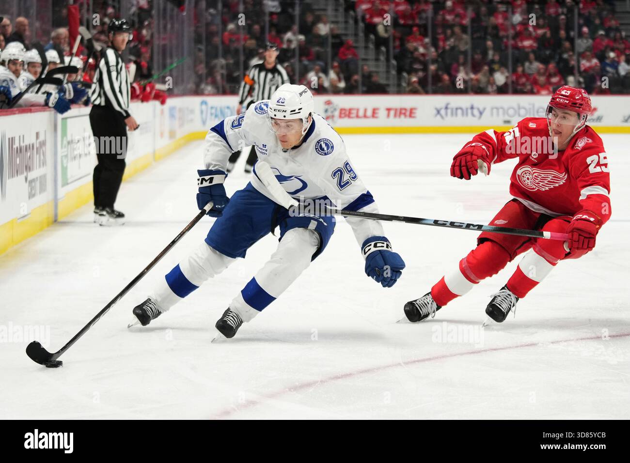 Tampa Bay Lightning right wing Pontus Holmberg, left, moves the puck ...