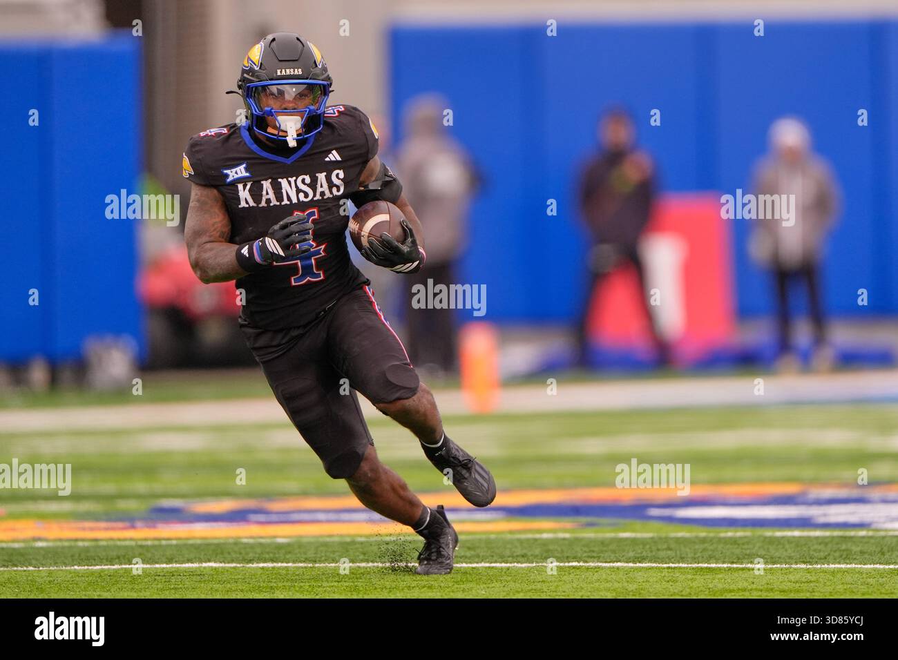 Kansas running back Leshon Williams runs the ball during the first half ...