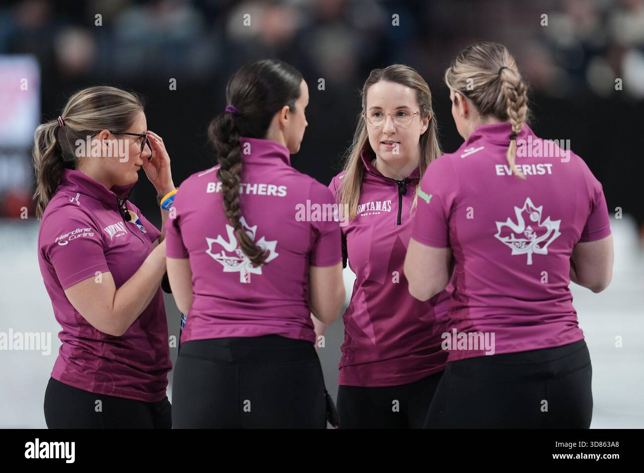 Skip Christina Black, second from right, speaks with teammates between ...