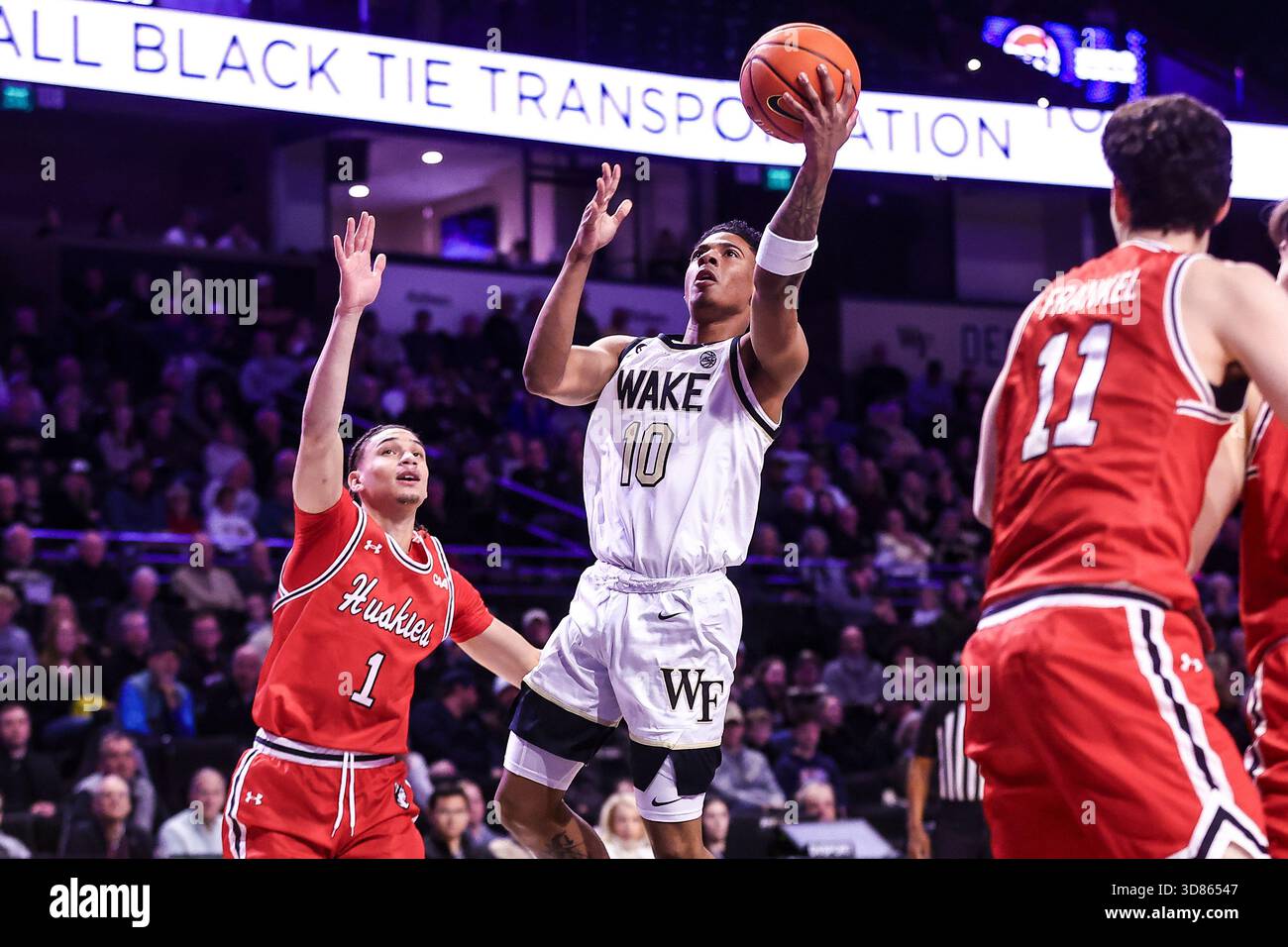 November 28, 2025: Wake Forest guard Sebastian Akins (10) goes up for ...