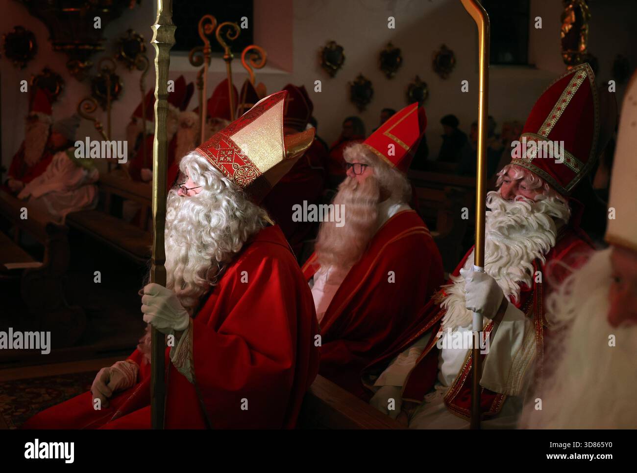 28 November 2025, Bavaria, Missen-Wilhams: St. Nicholas actors sit at ...