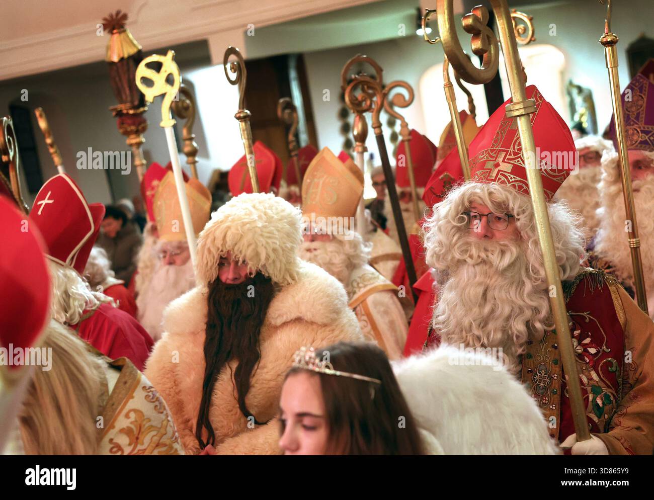 28 November 2025, Bavaria, Missen-Wilhams: St. Nicholas actors sit at ...
