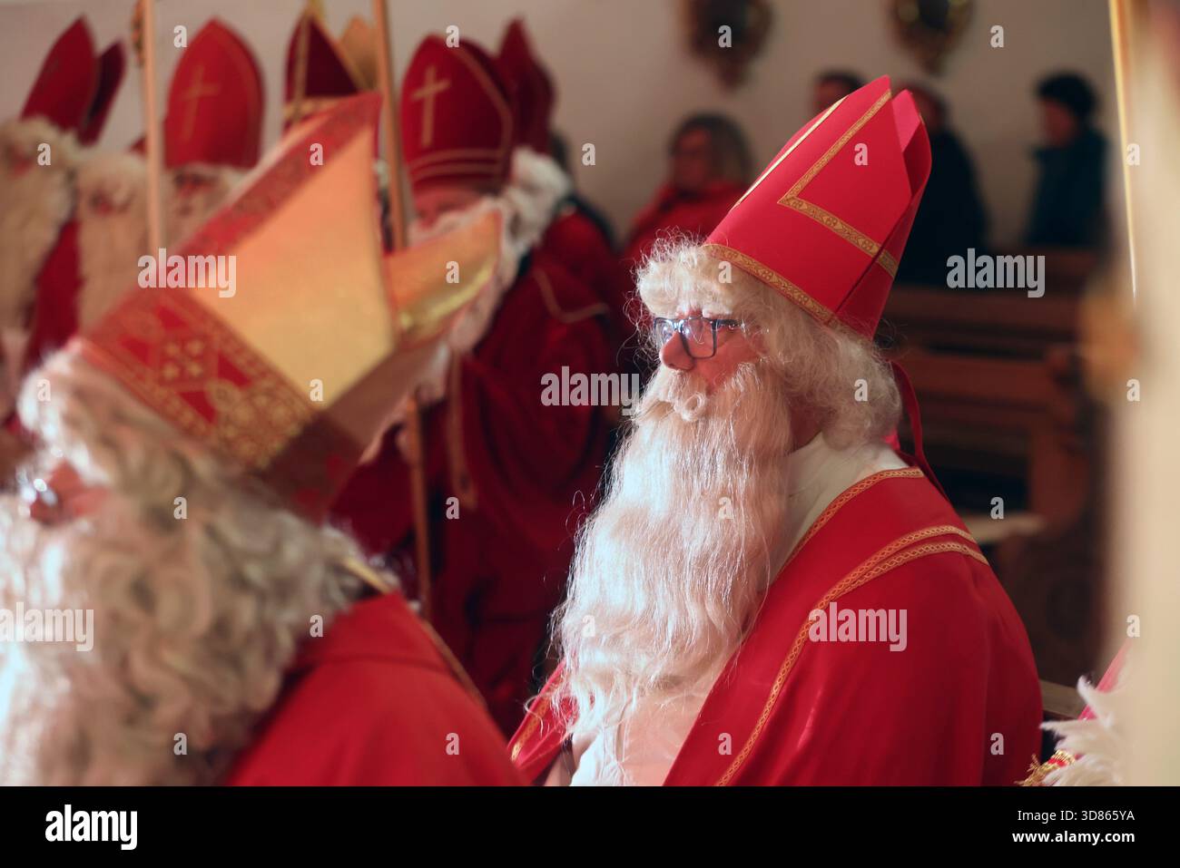28 November 2025, Bavaria, Missen-Wilhams: St. Nicholas actors sit at ...
